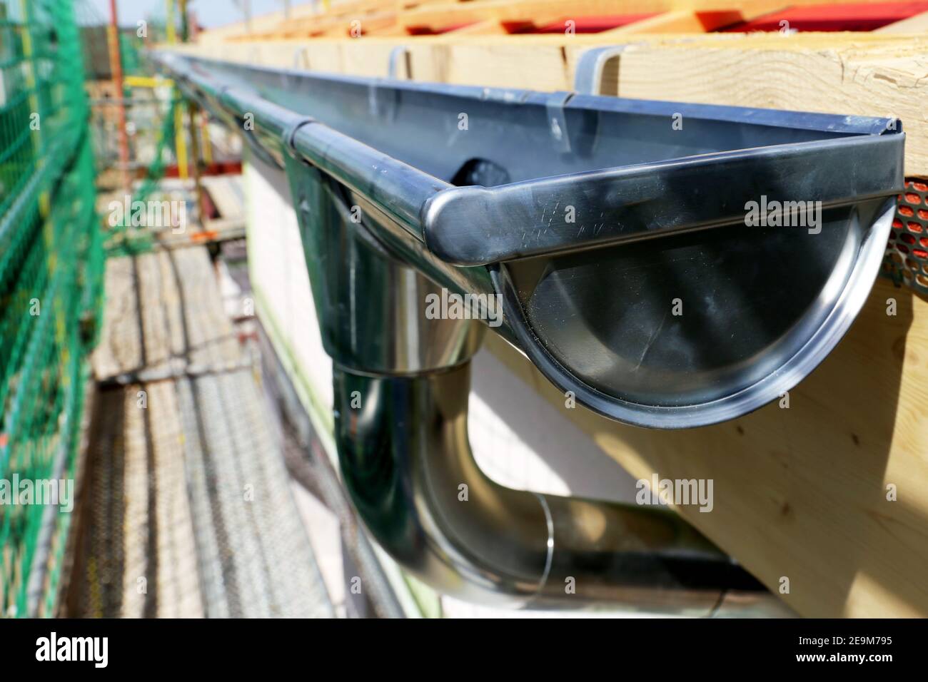 Roof gutter on a new tiled roof Stock Photo - Alamy