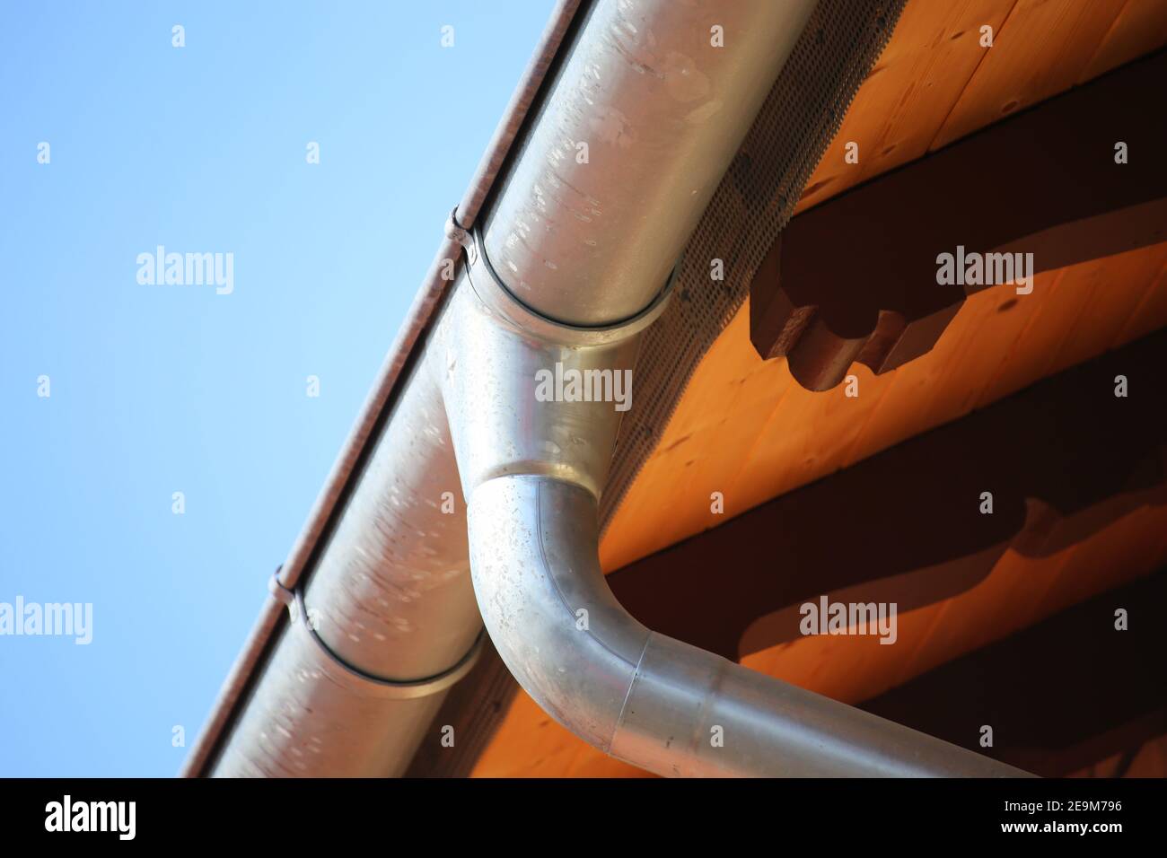 Roof gutter on a new tiled roof Stock Photo - Alamy
