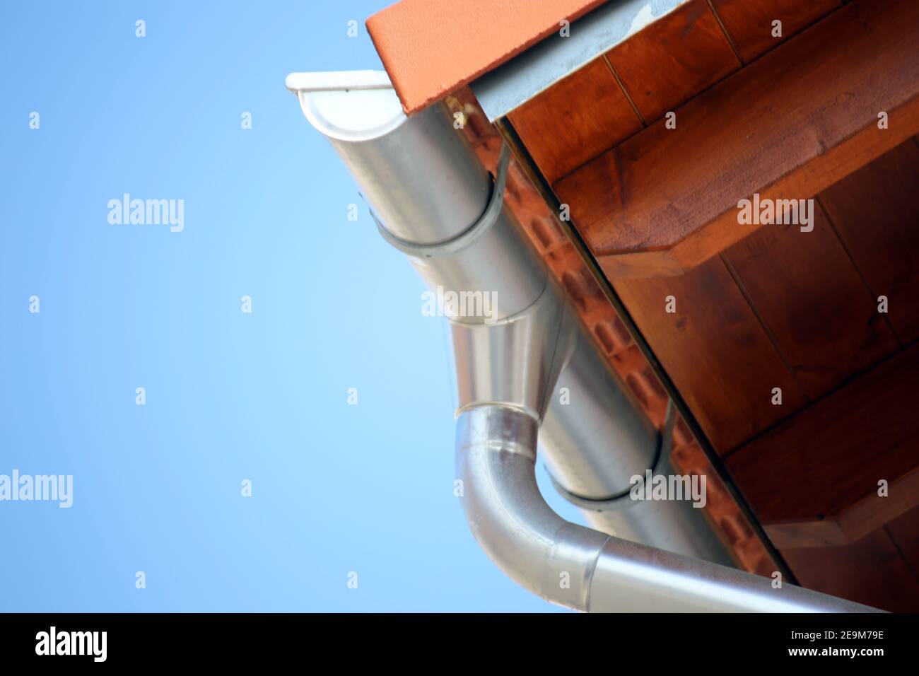 Roof gutter on a new tiled roof Stock Photo - Alamy