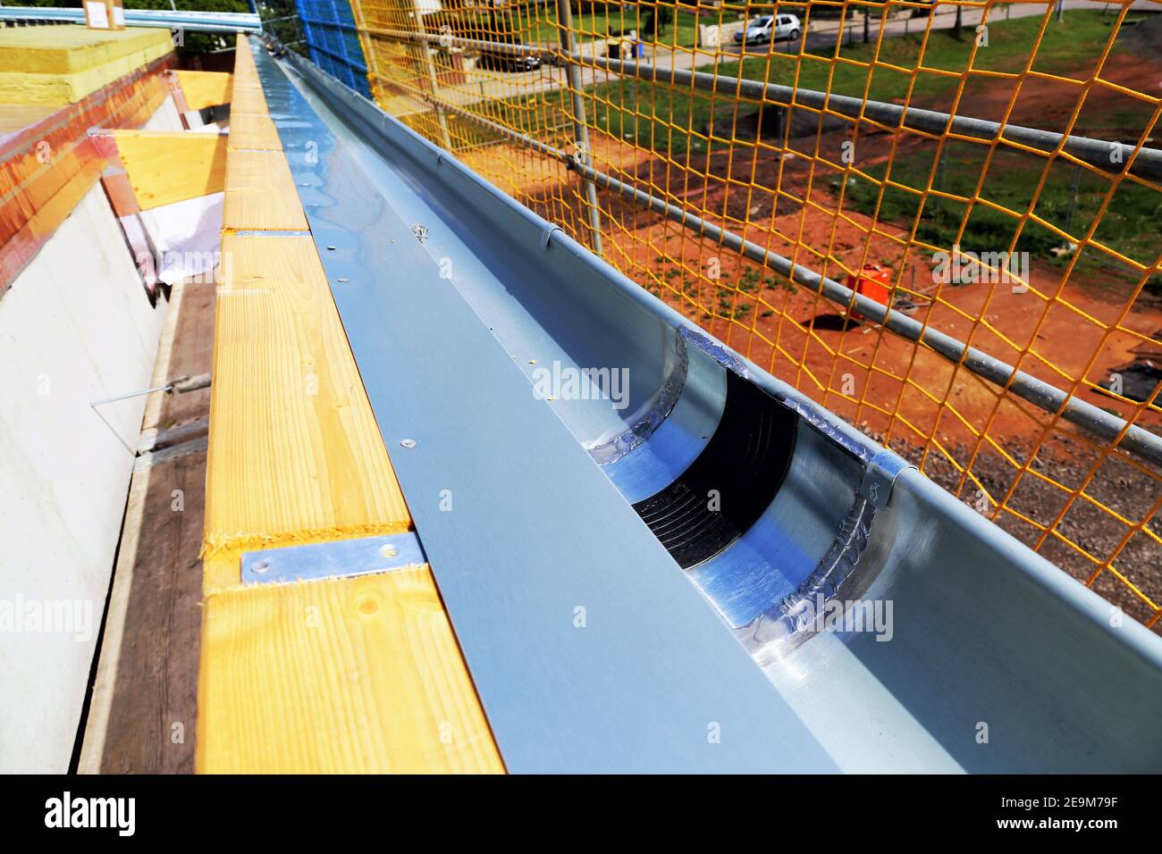 Roof gutter on a new tiled roof Stock Photo - Alamy