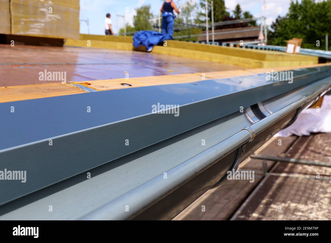 Roof gutter on a new tiled roof Stock Photo - Alamy