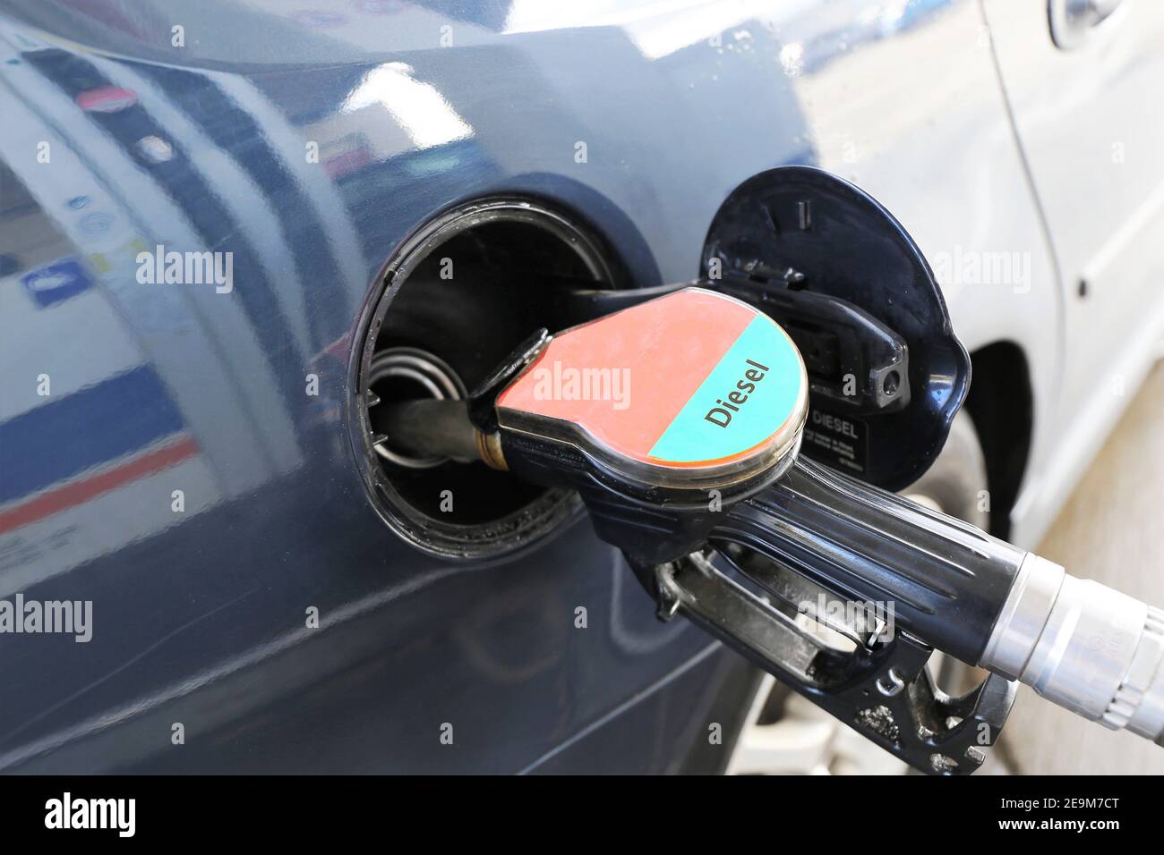 Close-up of a fuel nozzle during refueling of a passenger car Stock ...