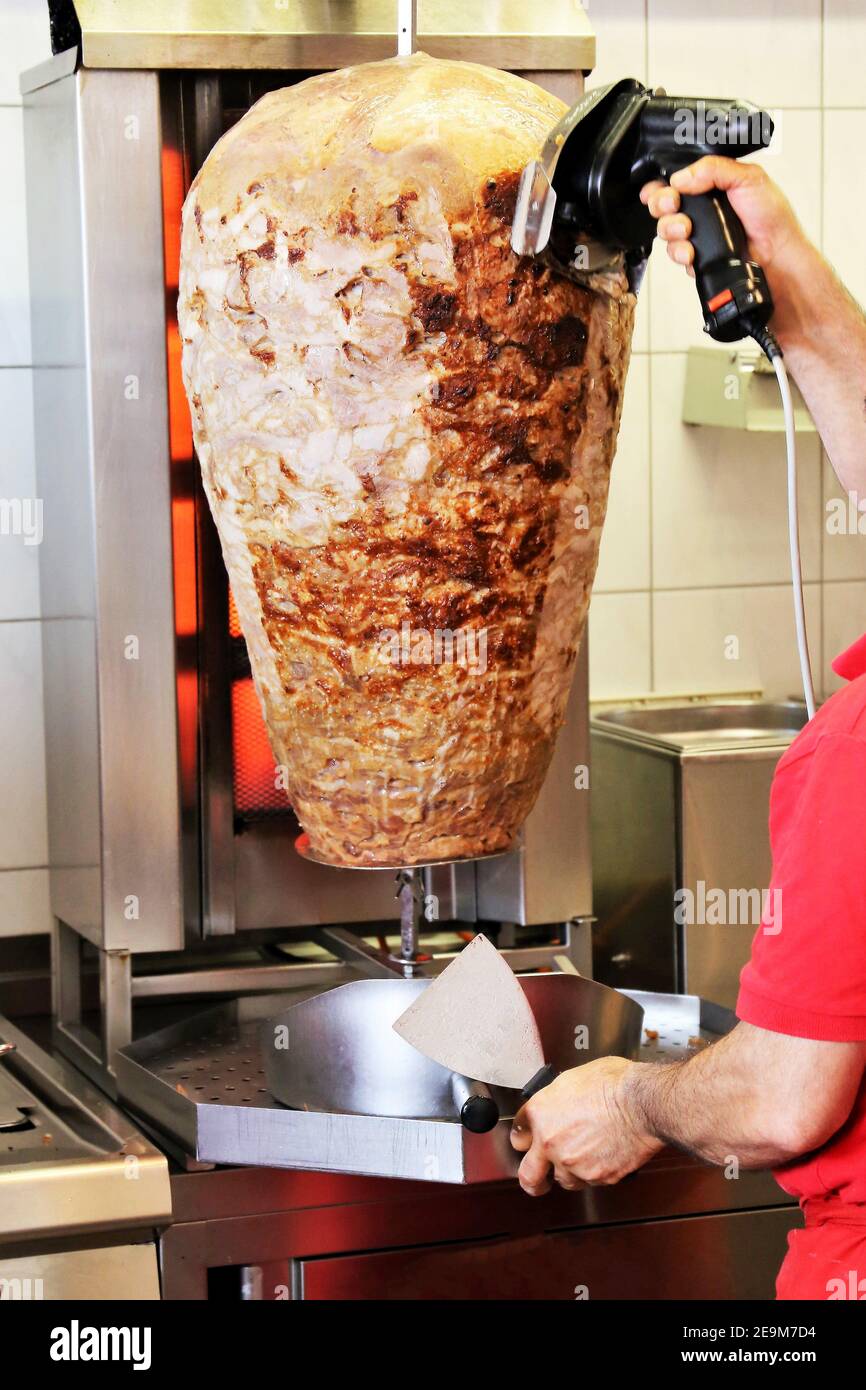 Doner kebab on the rotating spit Stock Photo - Alamy
