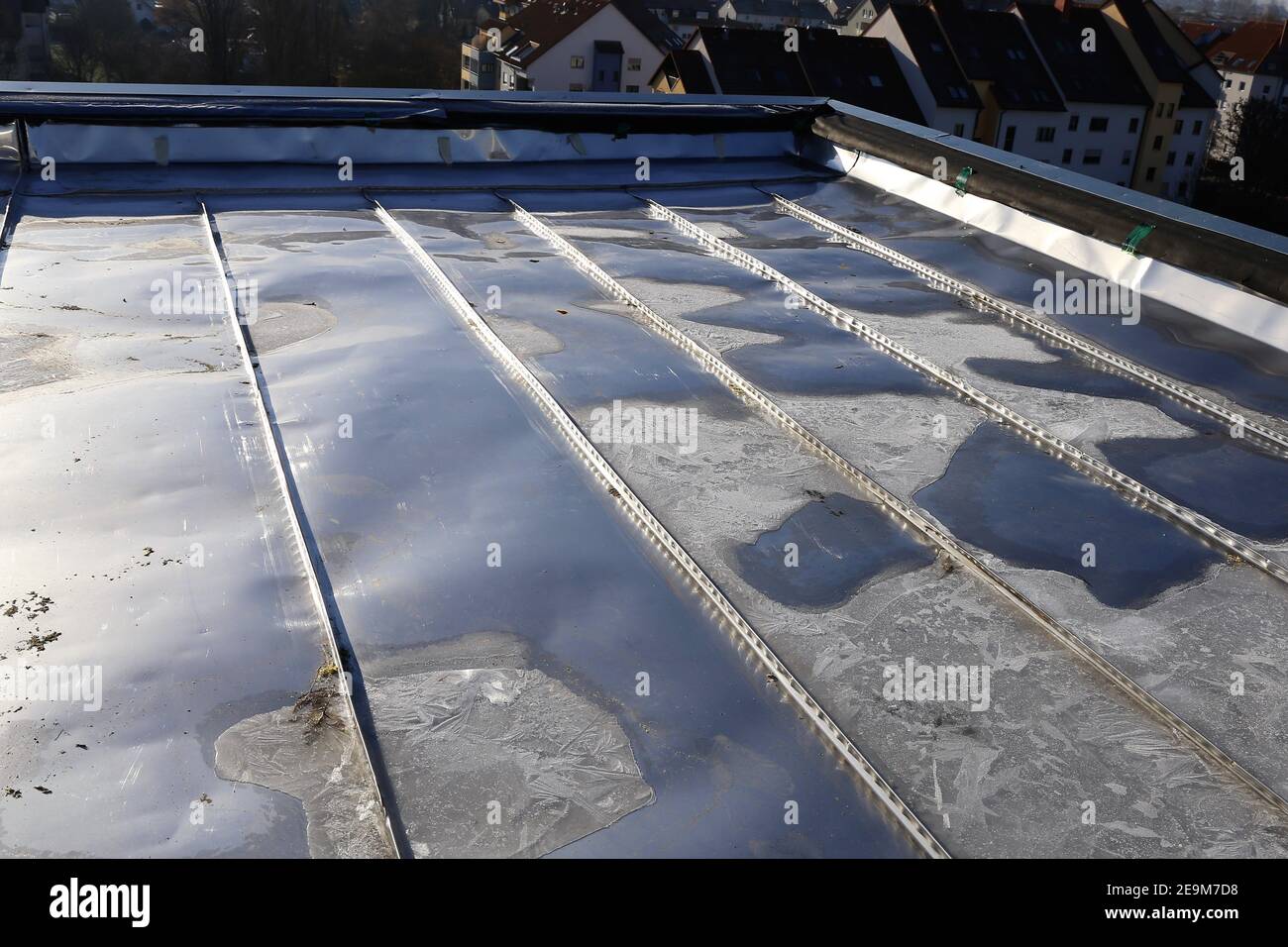 Roll seam welded stainless steel flat roof on a building Stock Photo ...