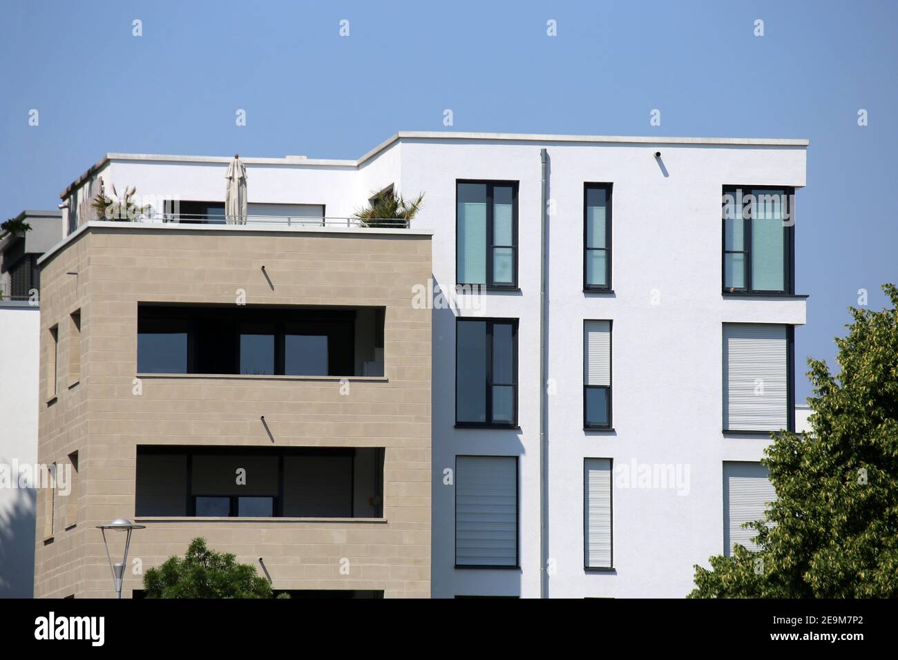 Modern apartment building in urban style Stock Photo - Alamy