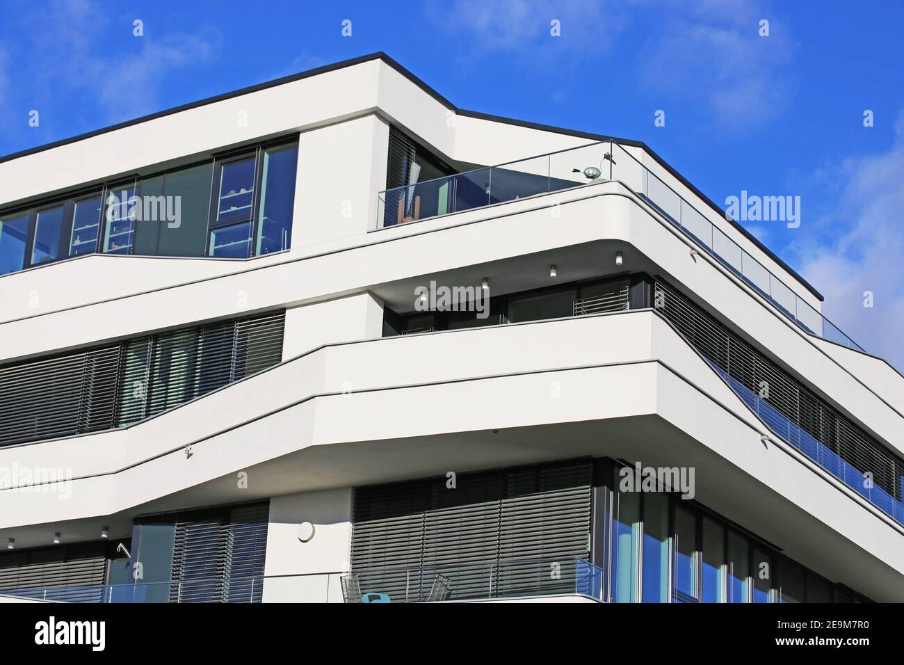 Modern apartment building in urban style Stock Photo - Alamy