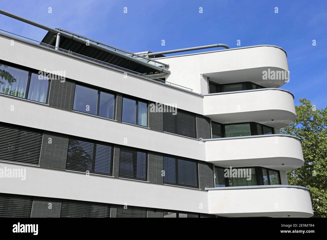 Modern apartment building in urban style Stock Photo - Alamy
