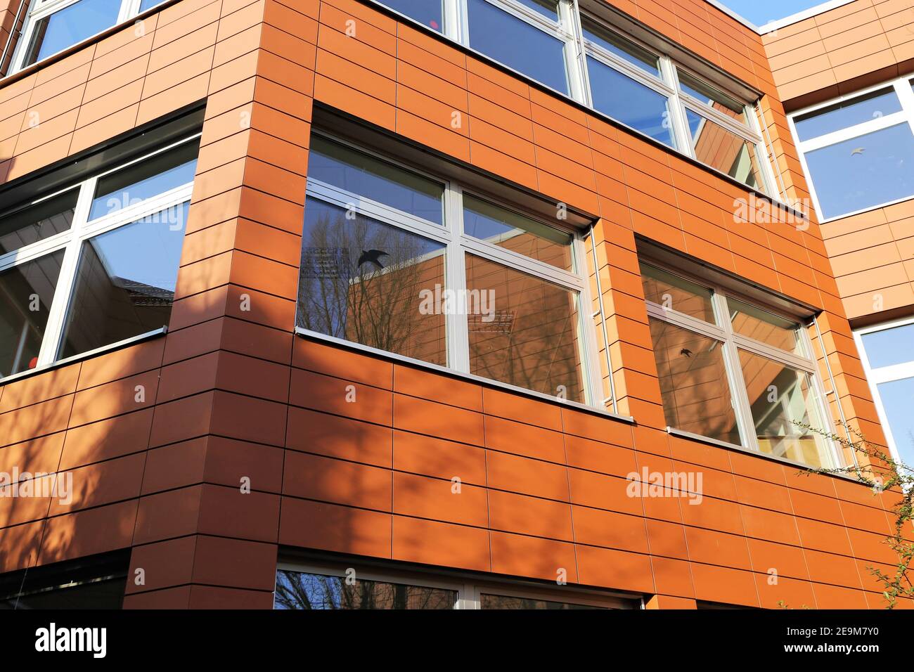 Modern building with facade cladding Stock Photo - Alamy