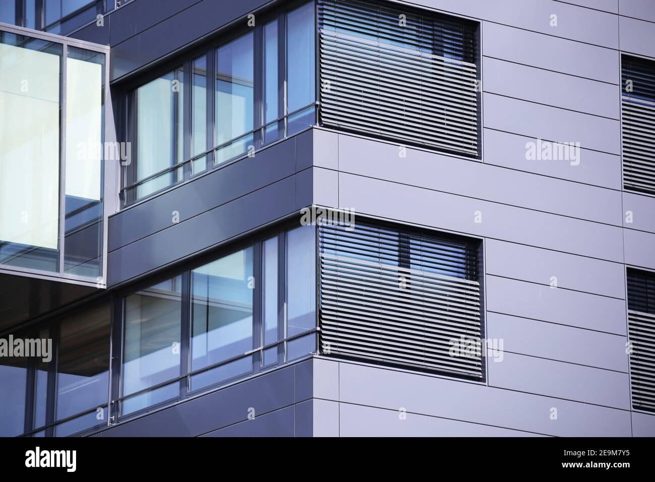 Modern building with facade cladding Stock Photo - Alamy