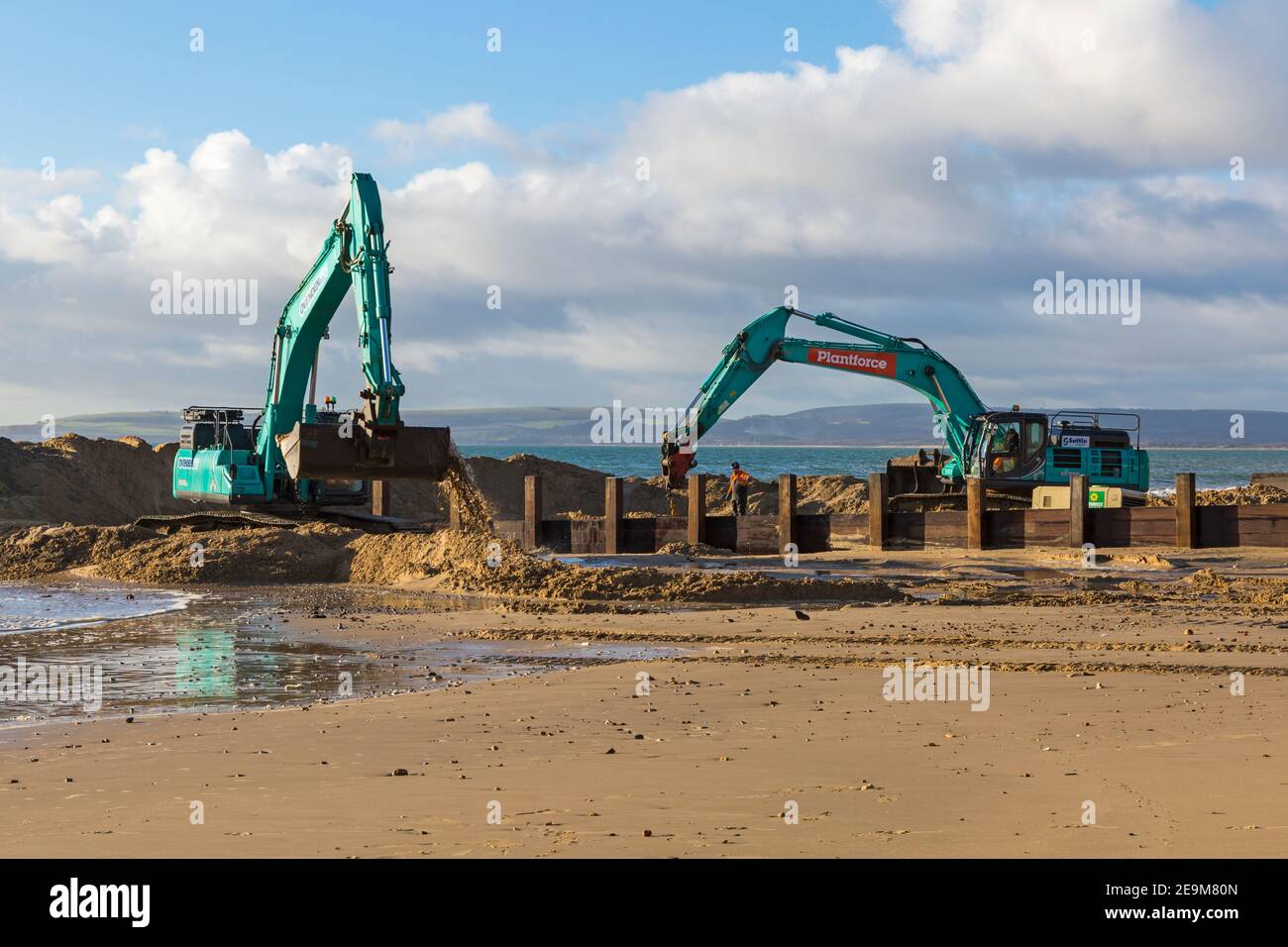 Heavy machinery working on timber groyne renewal programme taking place ...