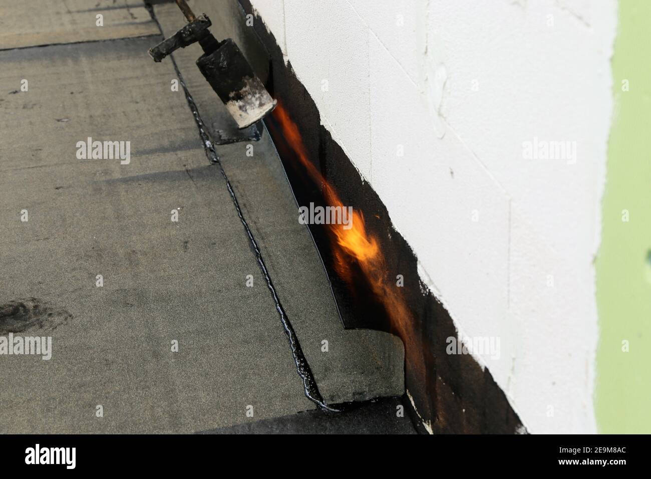 Professional flat roof waterproofing with bitumen welded sheeting Stock Photo - Alamy