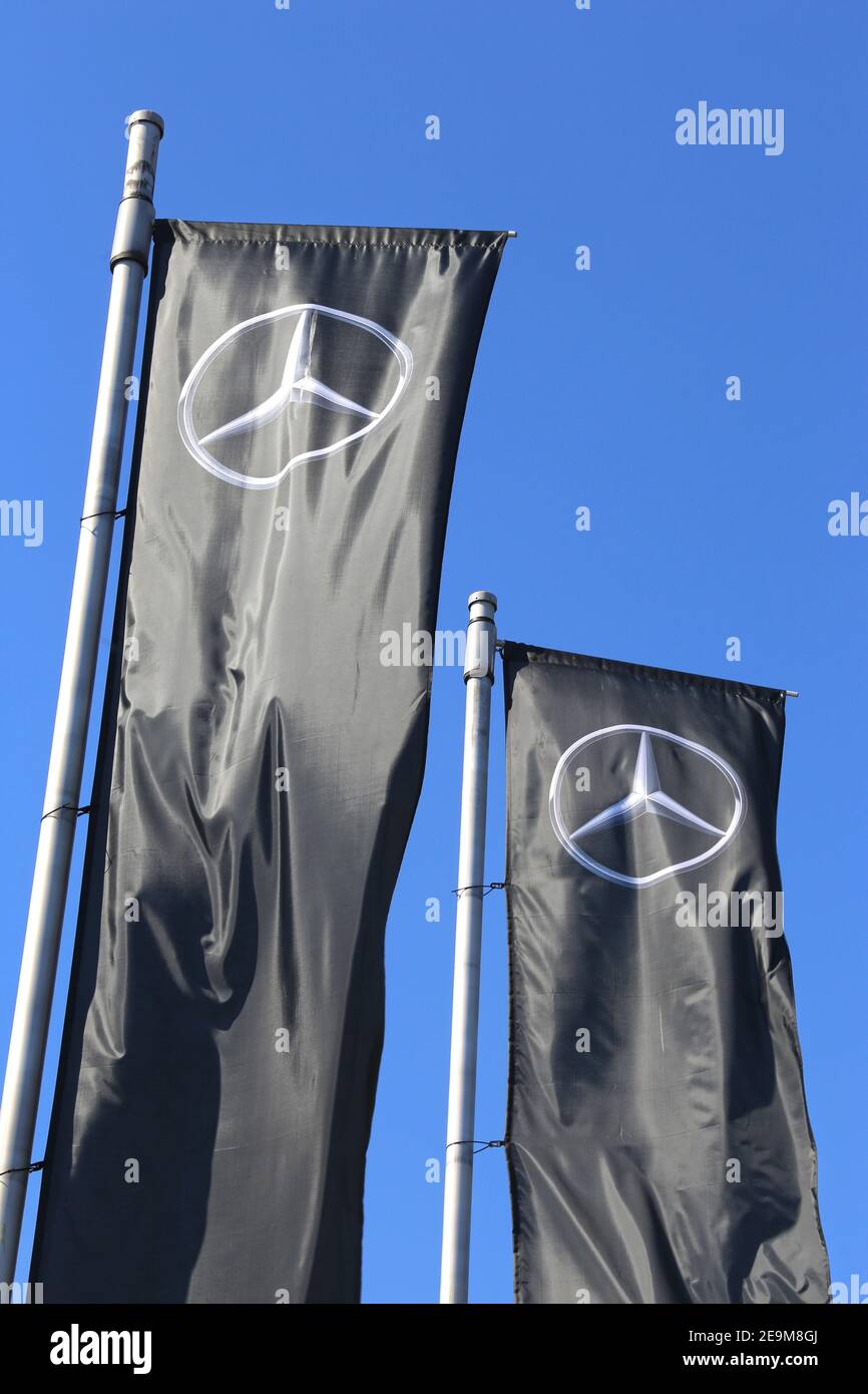 Flag with the Mercedes Benz star in front of a blue sky (Mannheim ...