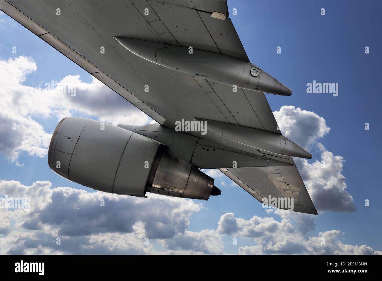 Airplane wing, photographed from below Stock Photo - Alamy