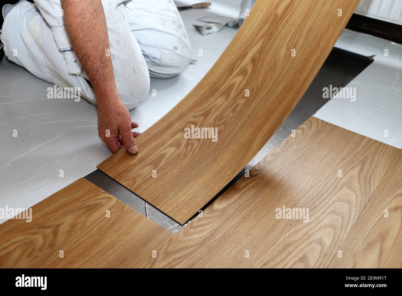 Professional installation of vinyl flooring or pvc flooring Stock Photo ...