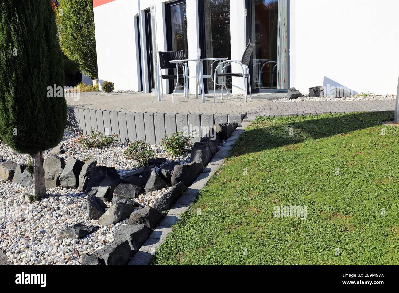 Well maintained ornamental garden with modern paved garden terrace ...