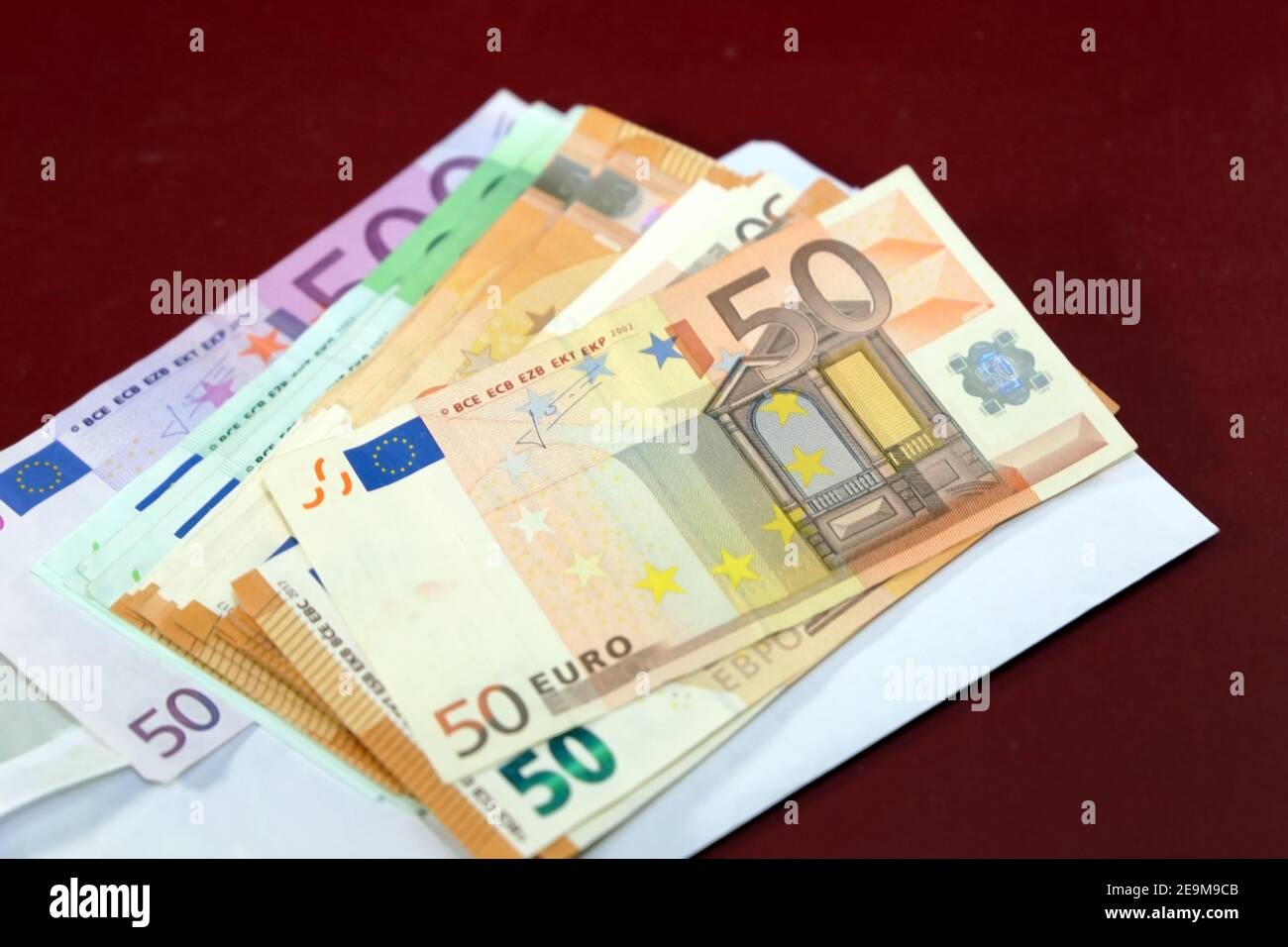 Envelope with Euro bank notes Stock Photo - Alamy