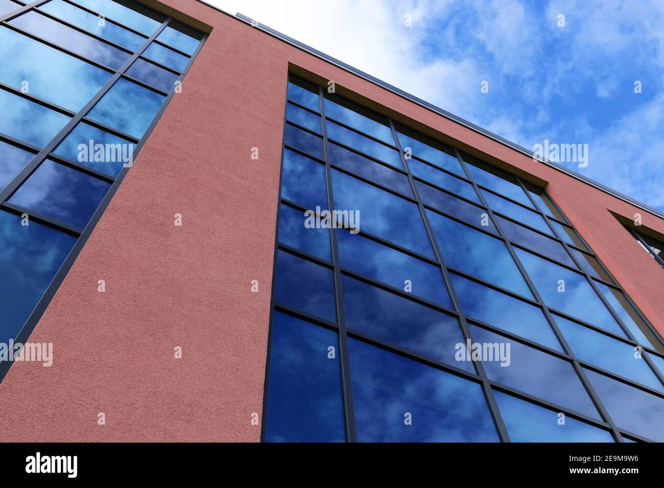 Building with large and modern glass facade Stock Photo - Alamy
