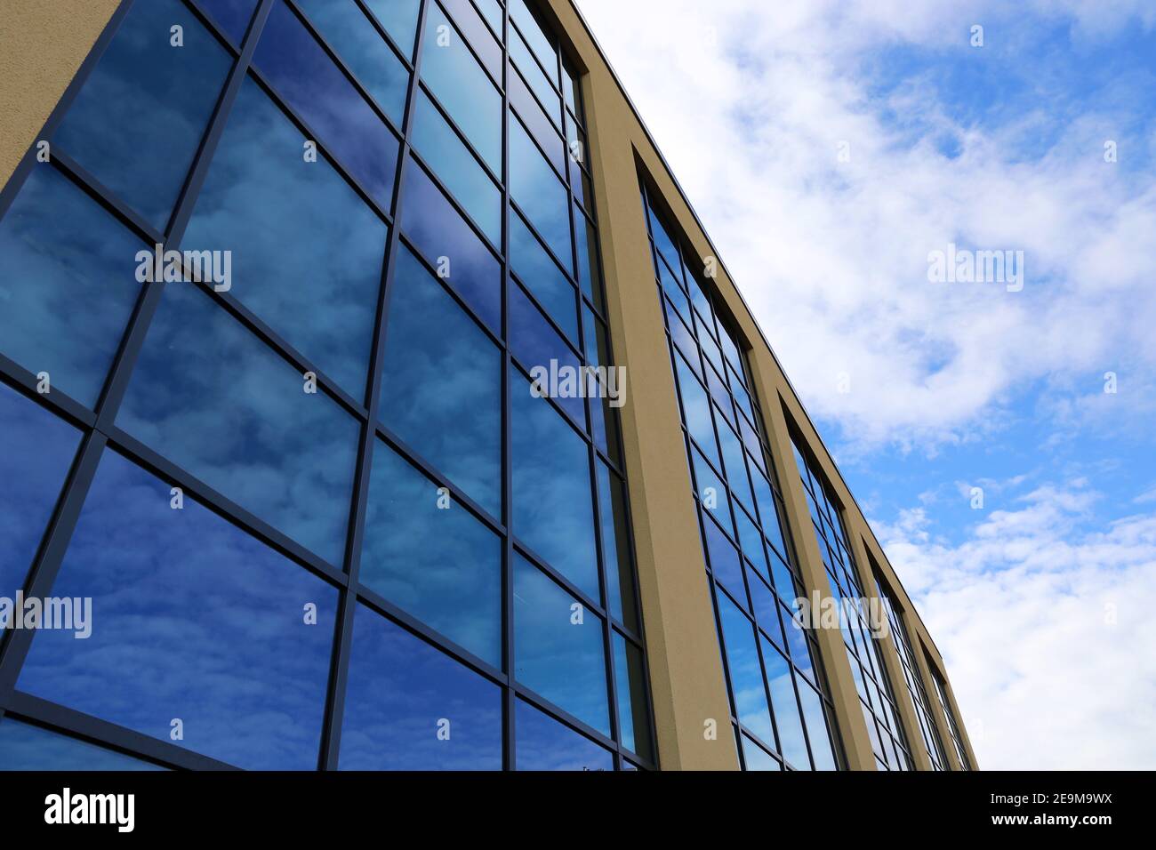 Building with large and modern glass facade Stock Photo - Alamy