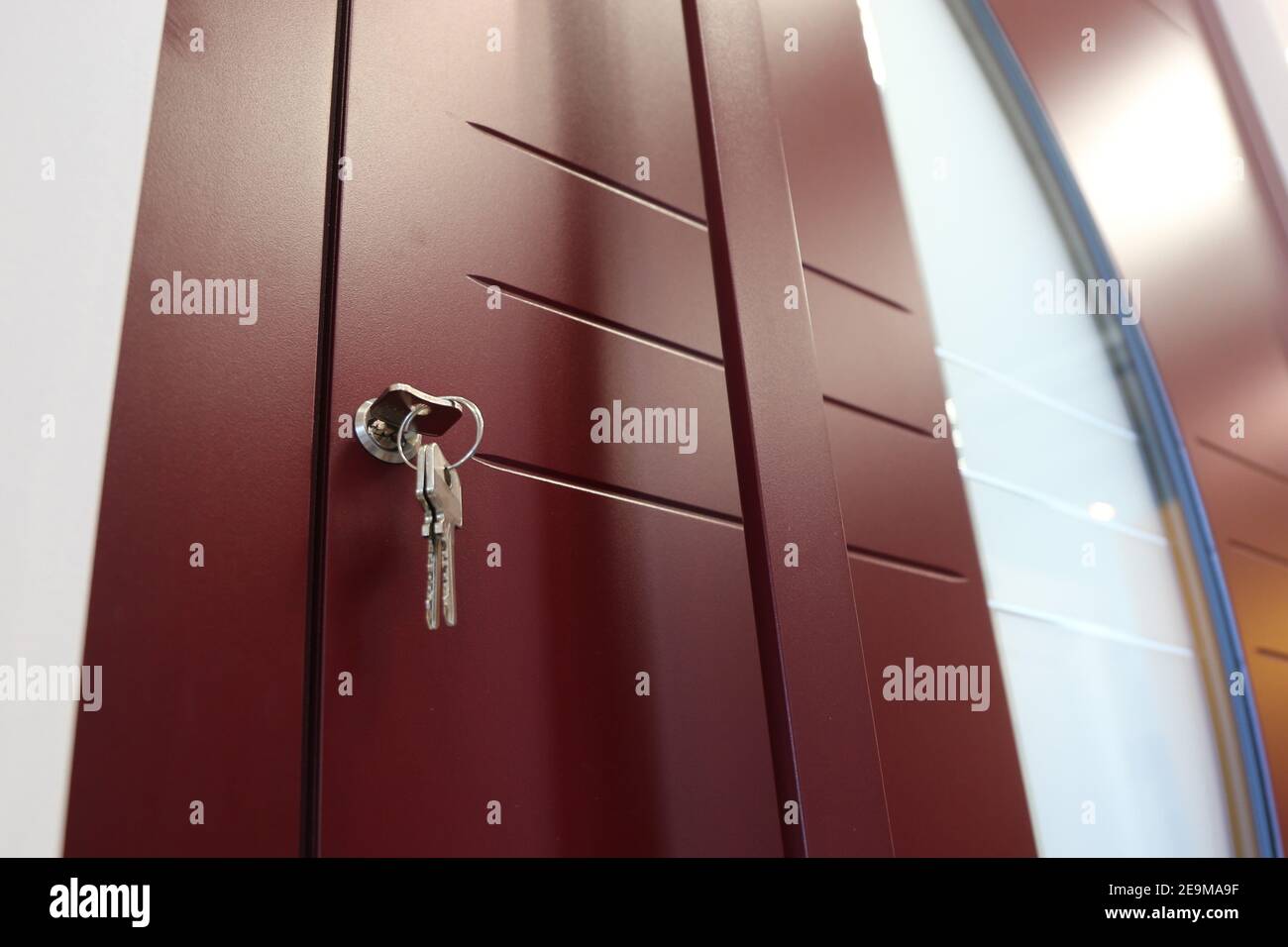 Modern front door with front door keys Stock Photo - Alamy