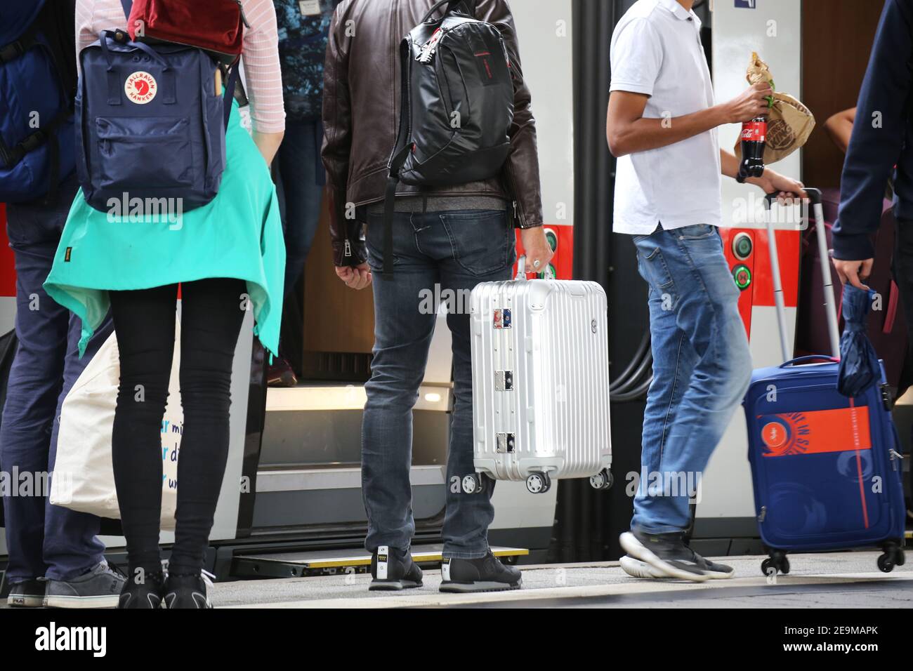 Woman getting off train railway hi-res stock photography and images - Alamy