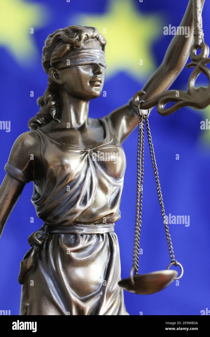 Symbol image: Justitia in front of a Europe flag Stock Photo - Alamy
