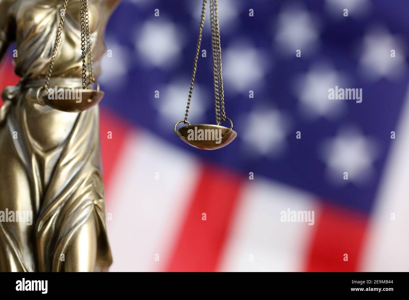 Symbol image: Justitia in front of a USA flag Stock Photo - Alamy