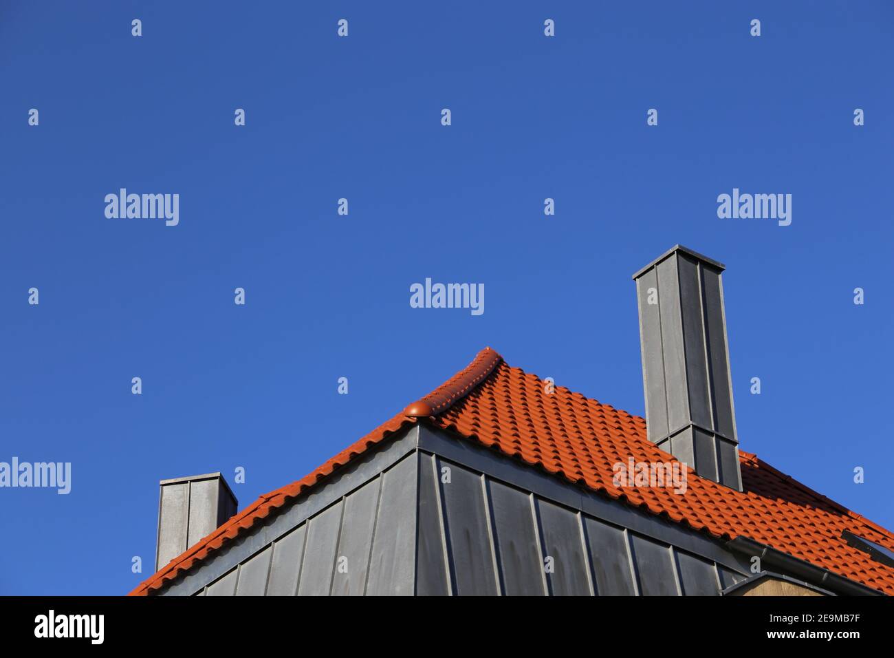 Chimney with stainless steel cladding on a newly covered roof Stock ...
