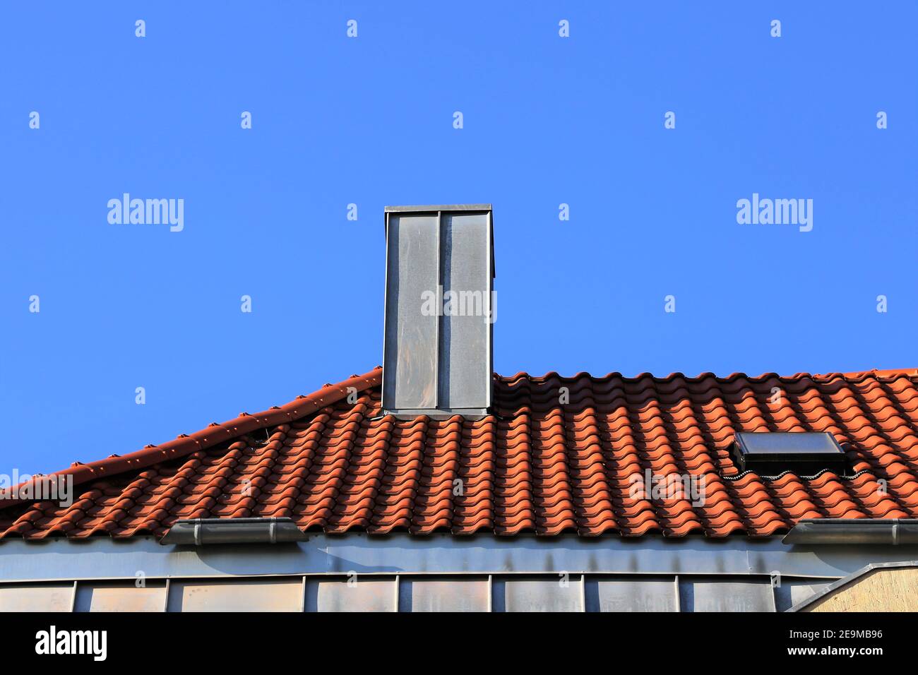 Chimney with stainless steel cladding on a newly covered roof Stock ...