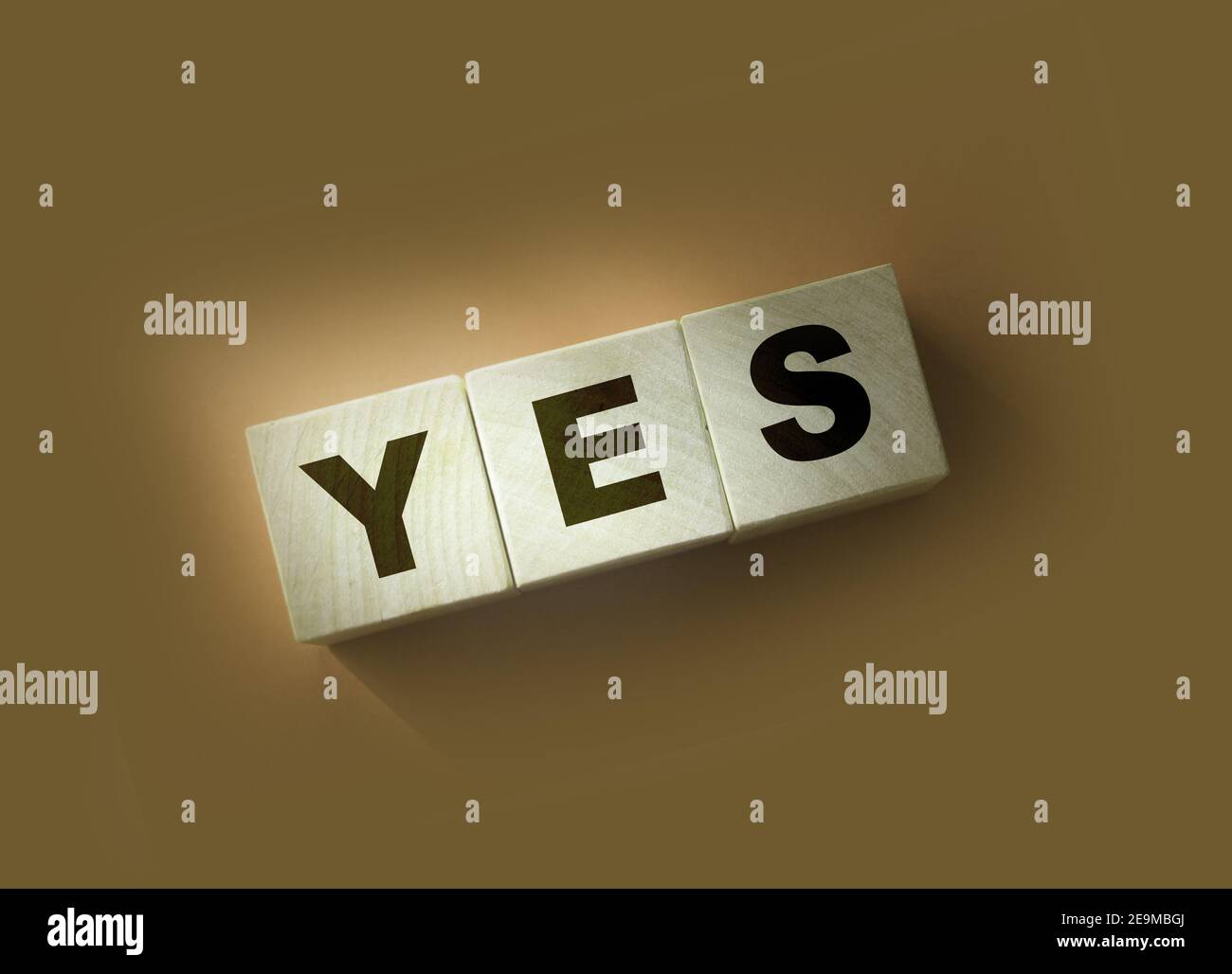 The word Yes written in black letters on wooden blocks. Message spells ...