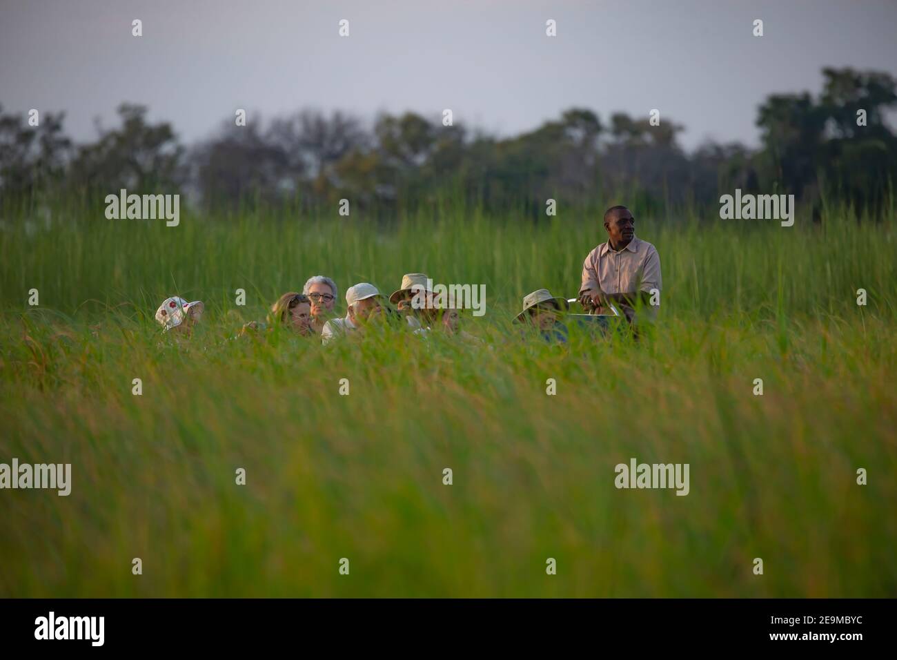 Tourists watching wildlife in the wilderness of Okavango Delta ...