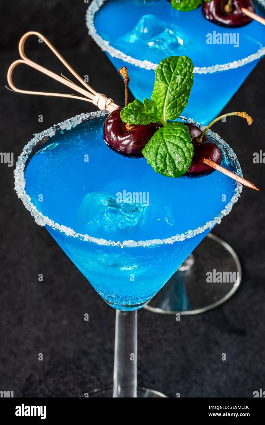 Blue Lagoon cocktails of blue curacao syrup mixed with vodka and ...