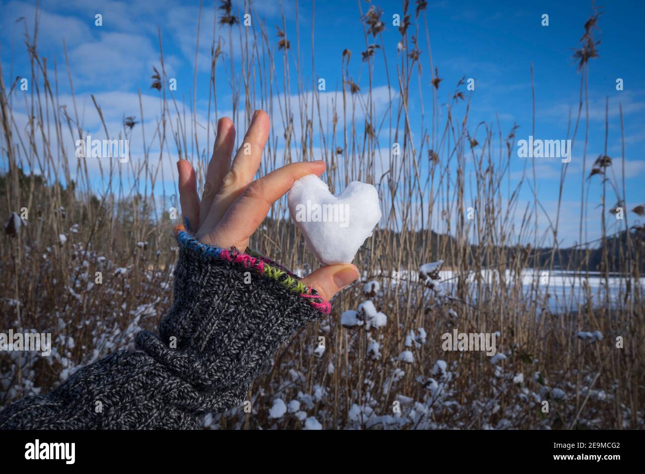 heart shaped snowball in winter landscape Stock Photo - Alamy