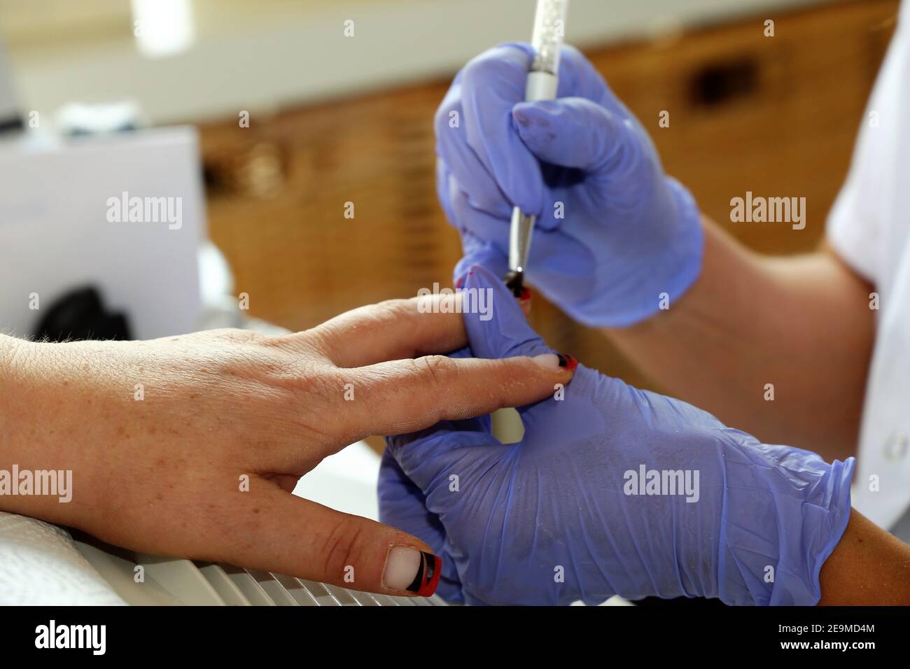 Senior woman receives a manicure Stock Photo - Alamy