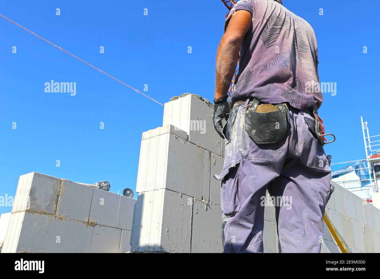 Construction worker (bricklayer) works on the construction site Stock ...