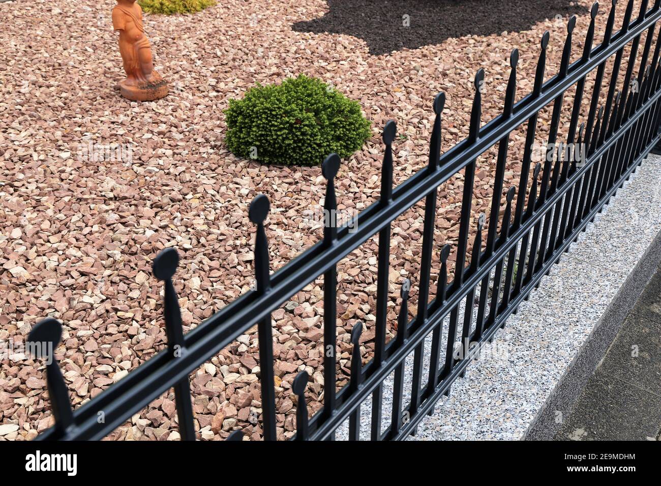 New high quality metal fence on the front yard of a residential house ...