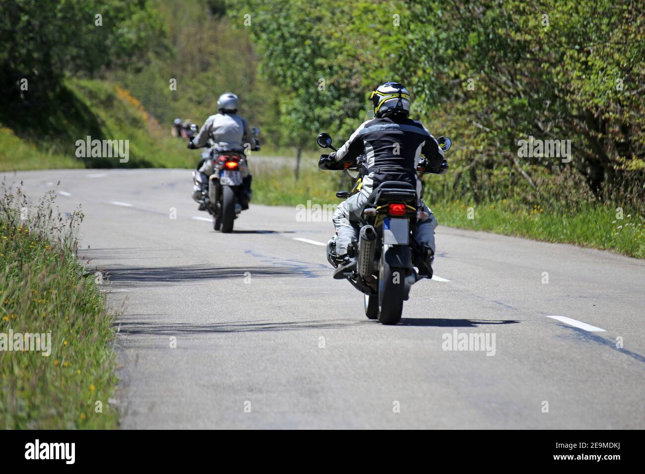 Sporty motorcyclist photographed from behind Stock Photo - Alamy