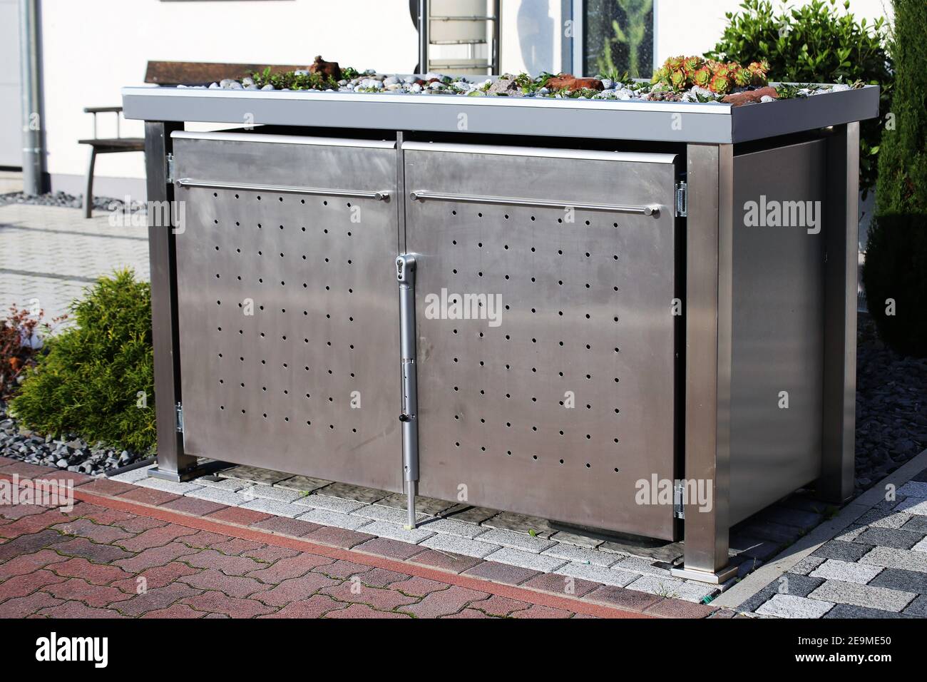 Garbage can storage, Garbage bin storage Stock Photo - Alamy