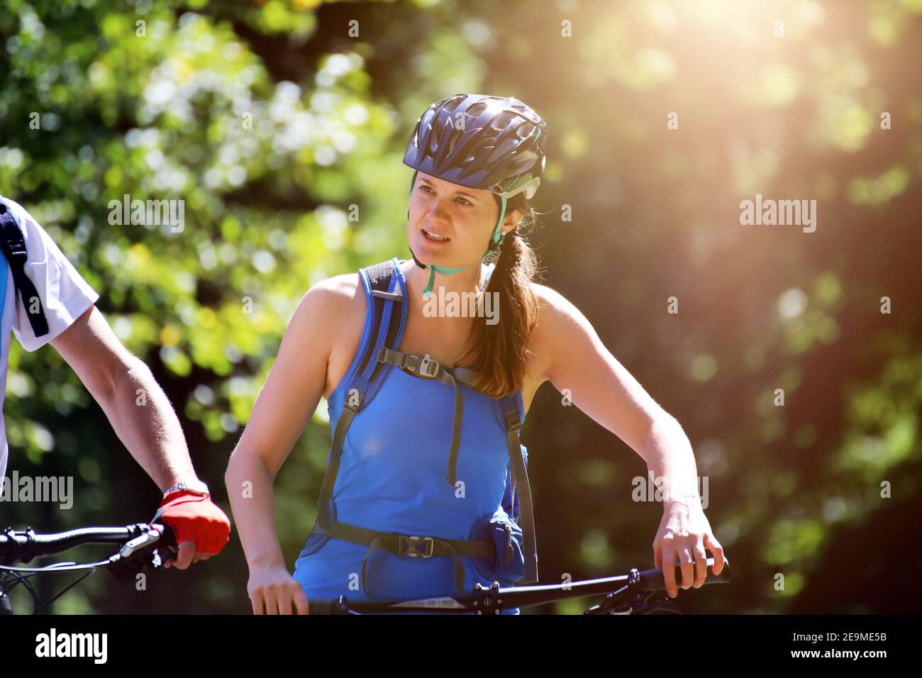 Portrait of a young attractive female mountain biker (model released ...