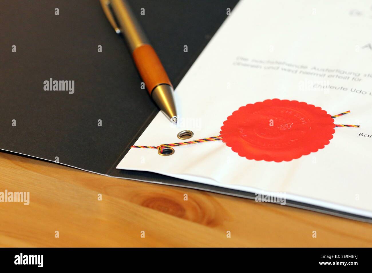 Notarized agreement with red official seal Stock Photo - Alamy