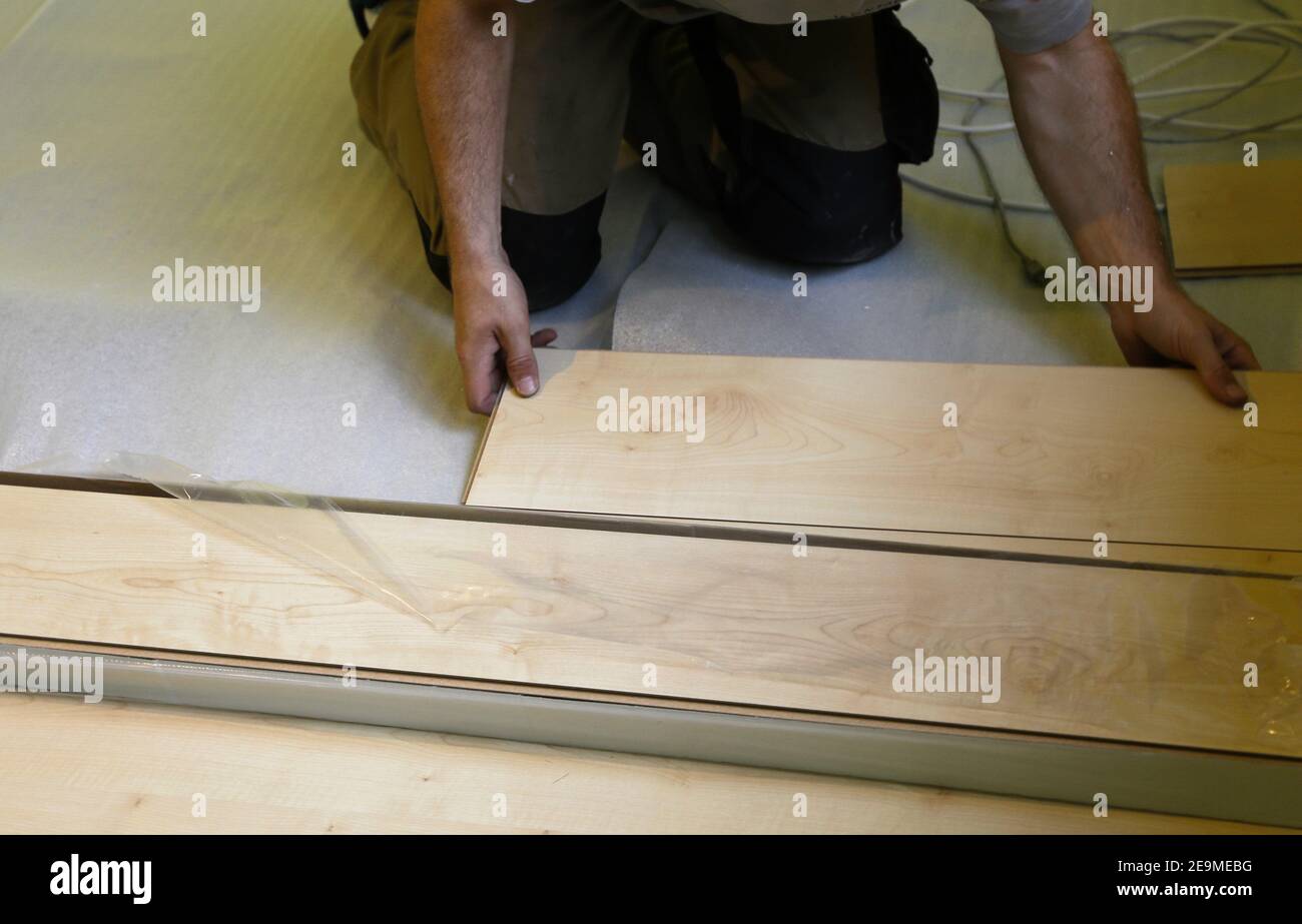 Professional installation of a parquet floor Stock Photo - Alamy