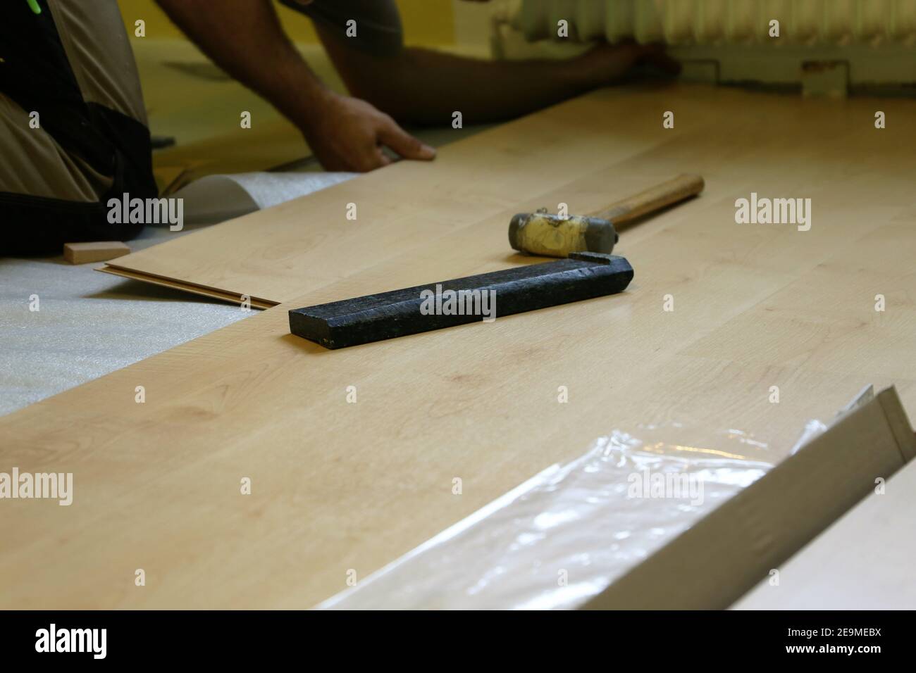 Professional installation of a parquet floor Stock Photo - Alamy