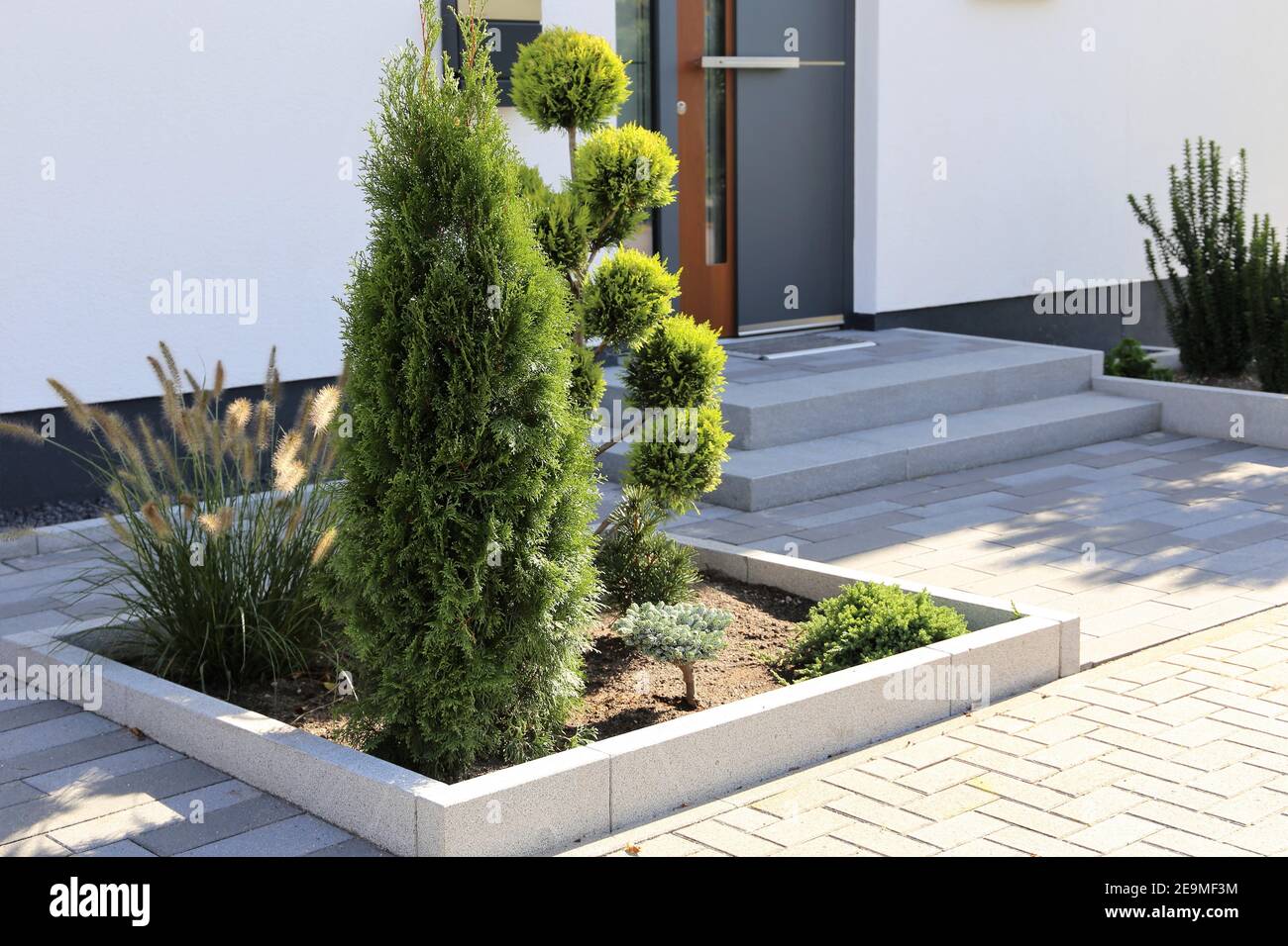 Residential house with modern paved front garden Stock Photo - Alamy