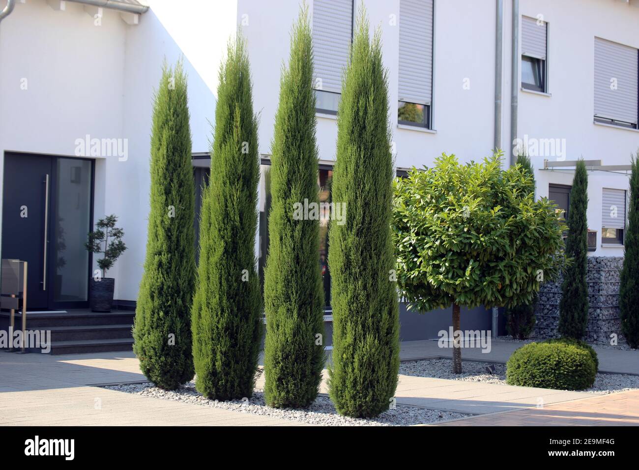 Residential house with modern paved front garden Stock Photo - Alamy