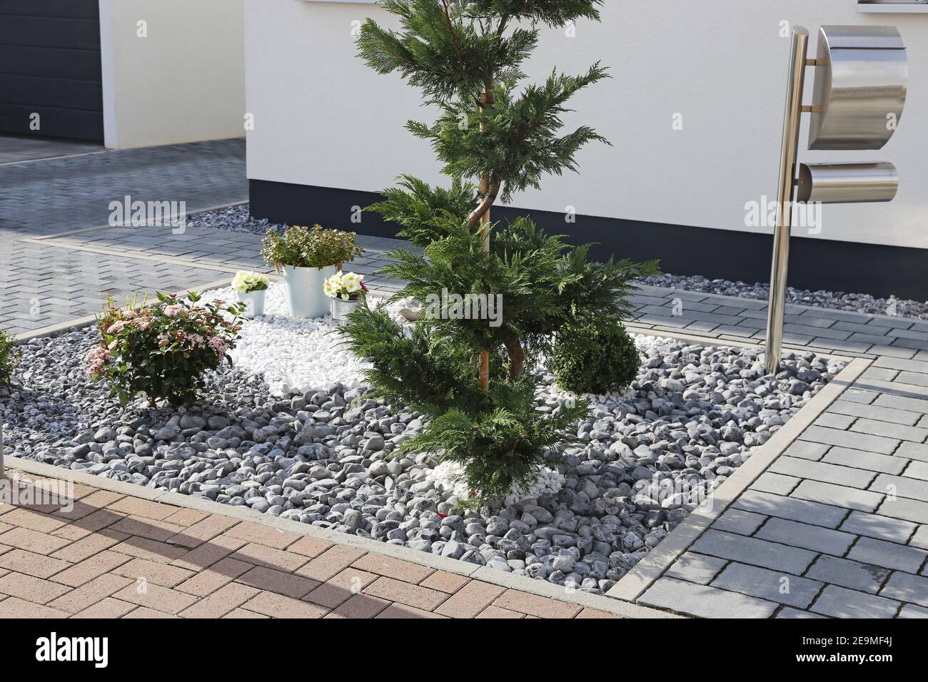 Residential house with modern paved front garden Stock Photo - Alamy