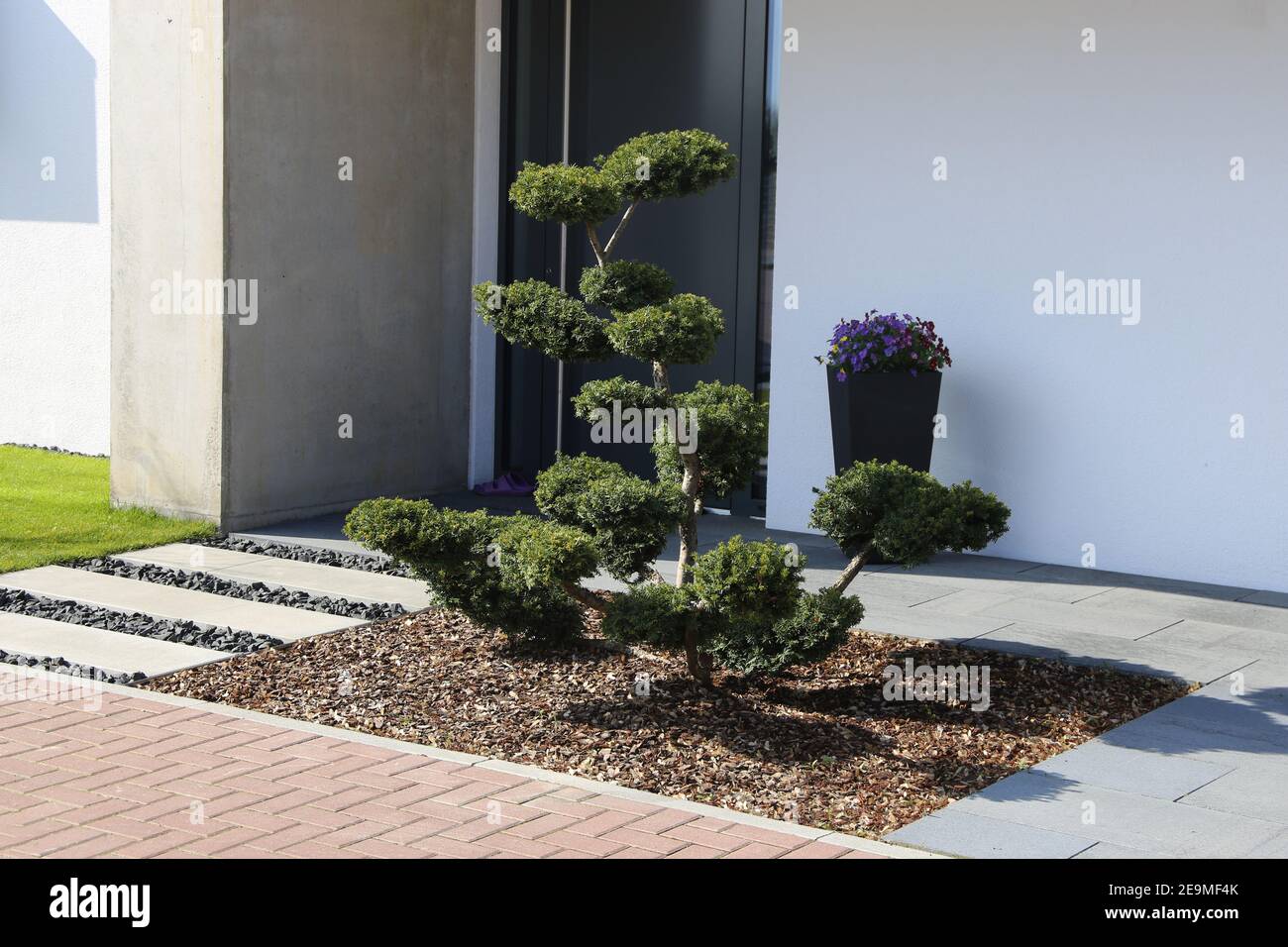 Residential house with modern paved front garden Stock Photo - Alamy