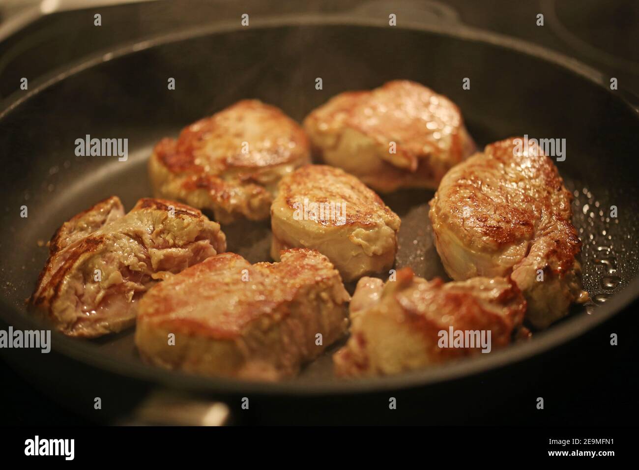 Beef fillet (beef tenderloin) grilling in the frying pan Stock Photo ...
