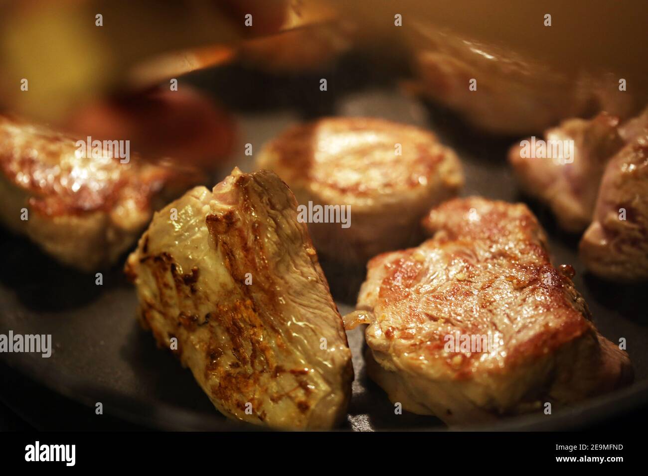 Beef fillet (beef tenderloin) grilling in the frying pan Stock Photo ...