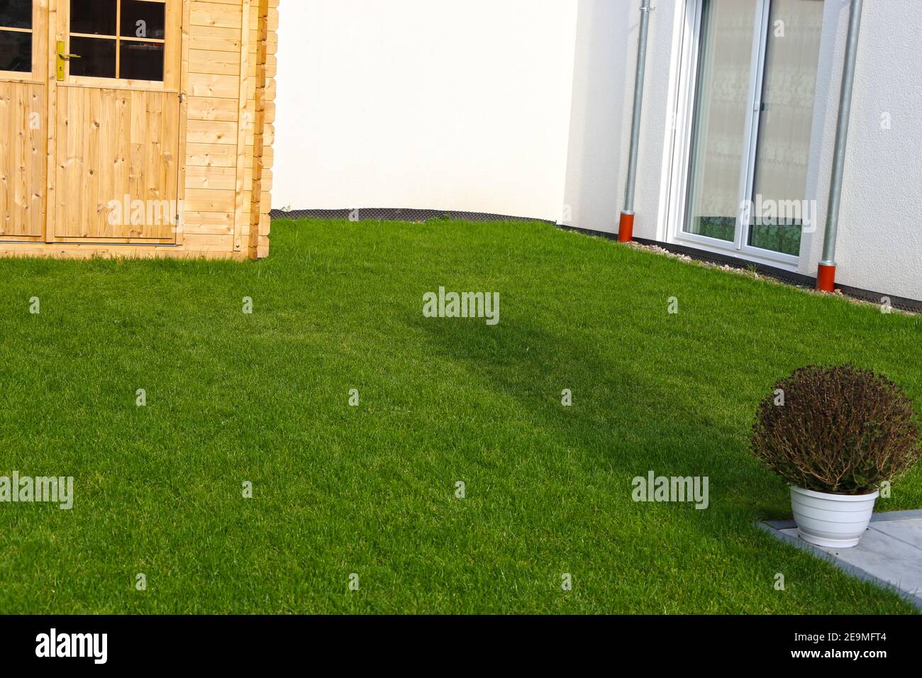 Back yard with very neat rolled turf Stock Photo - Alamy
