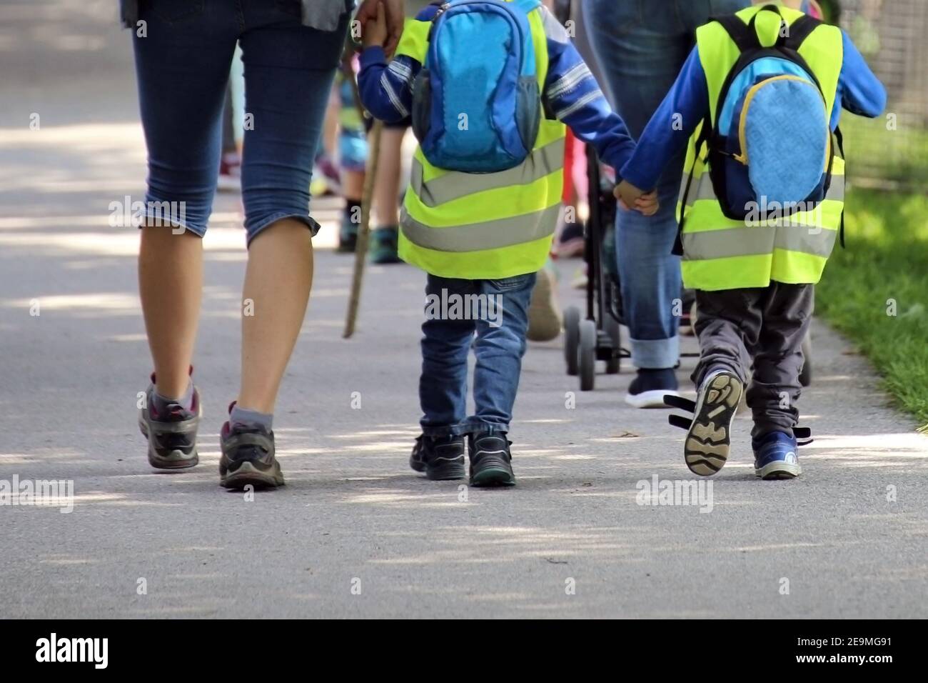 Preschool children of a kindergarten go on an excursion with their ...