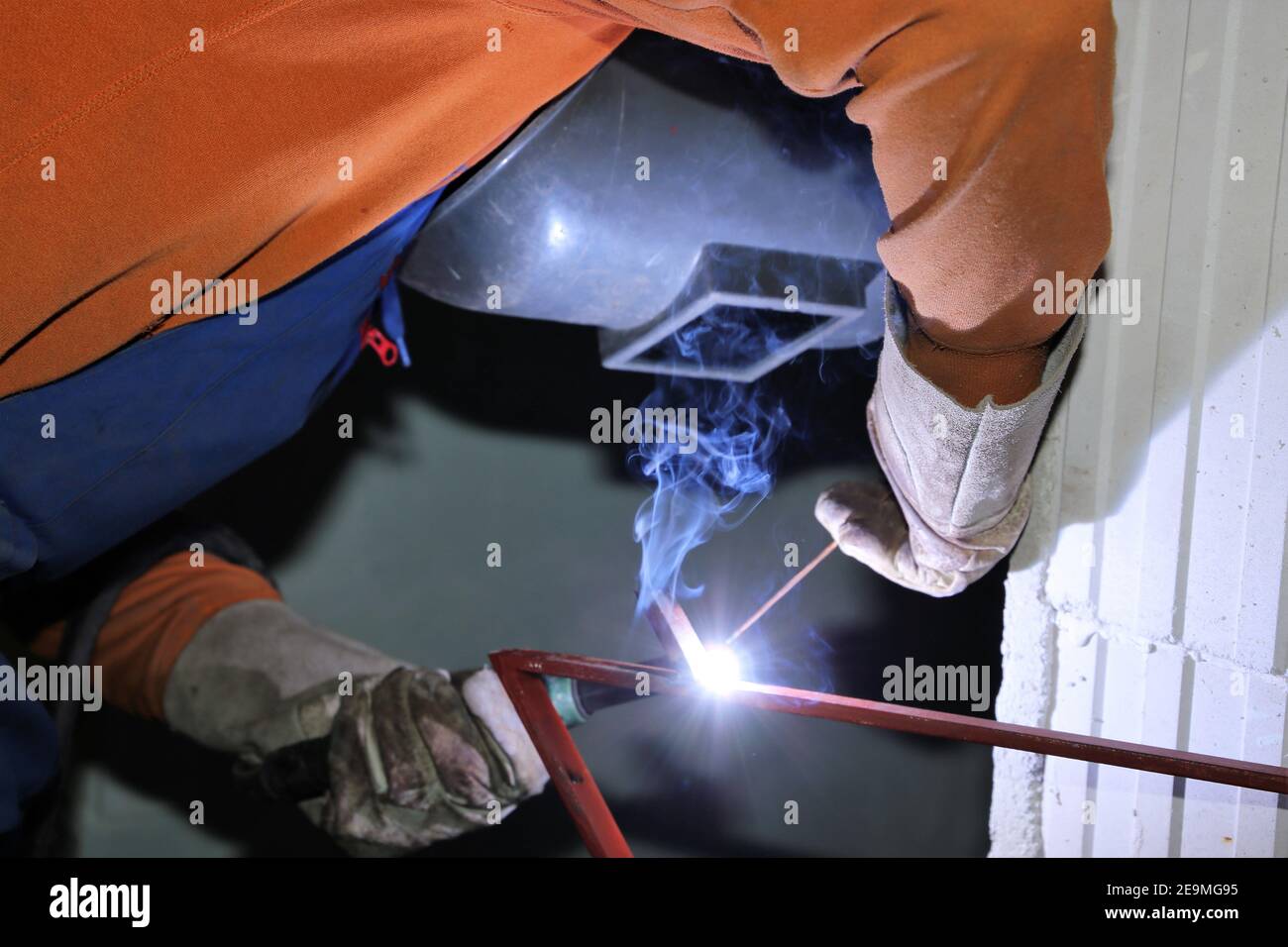 Metal worker doing welding work in his workshop Stock Photo - Alamy